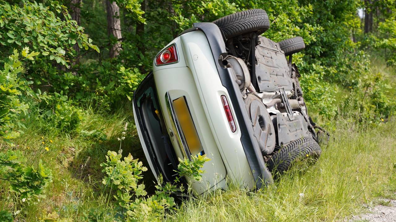 Car Upside Down In Lock After Collision With Oncoming Vehicle Minor